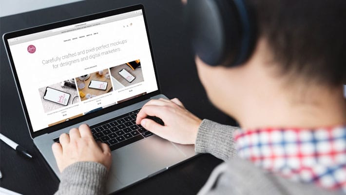 Developer Coding On His Macbook Pro Mockup » CSS Author