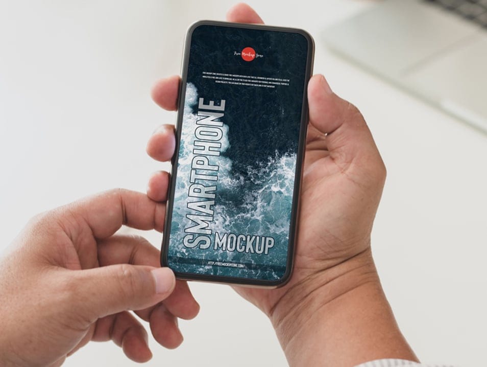 Free Person Holding Smartphone Mockup » CSS Author