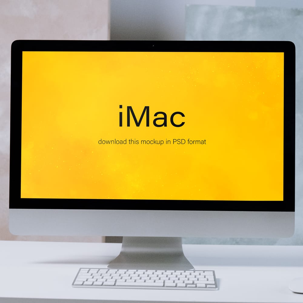 Free IMac On A White Table Mockup PSD